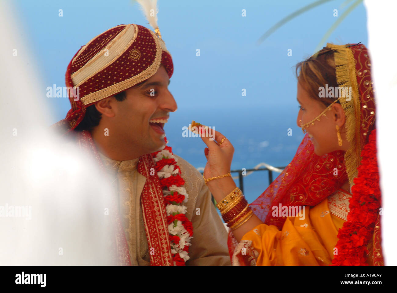 Tradditional Hindi wedding with groom wearing carnation flowers and ...
