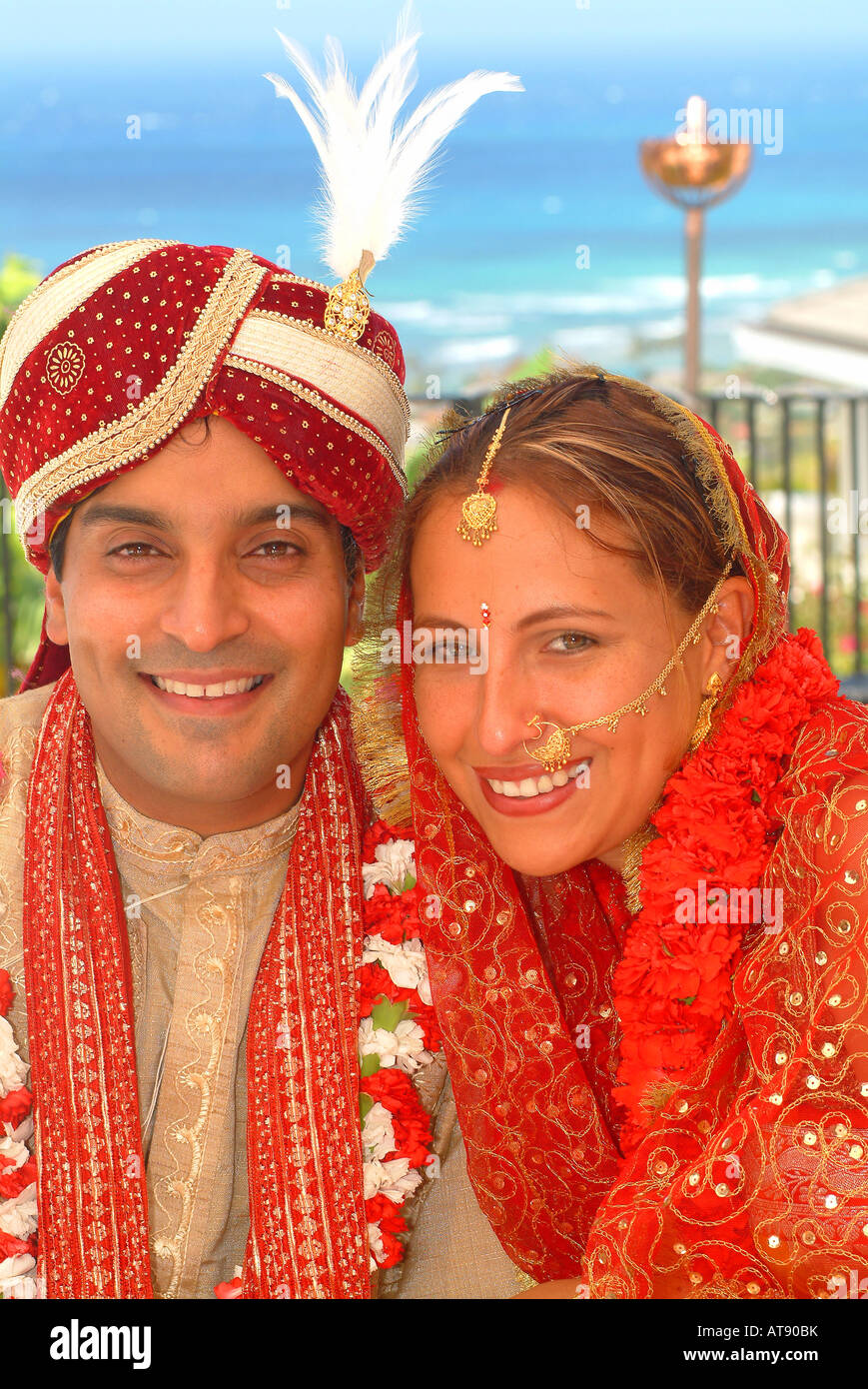 Tradditional Hindi wedding with groom wearing carnation flowers and ...