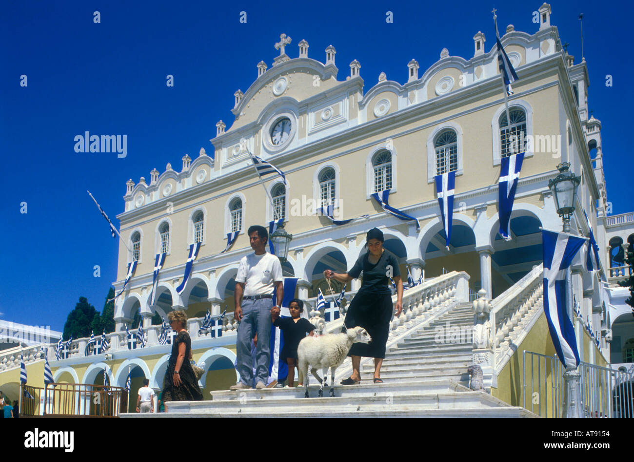 pilgrim family with a victim sheep in front of th church in Tinos place ...