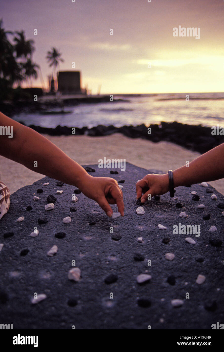 Two women playing konane, Hawaiian checkers, Puu honua honaunau, city ...
