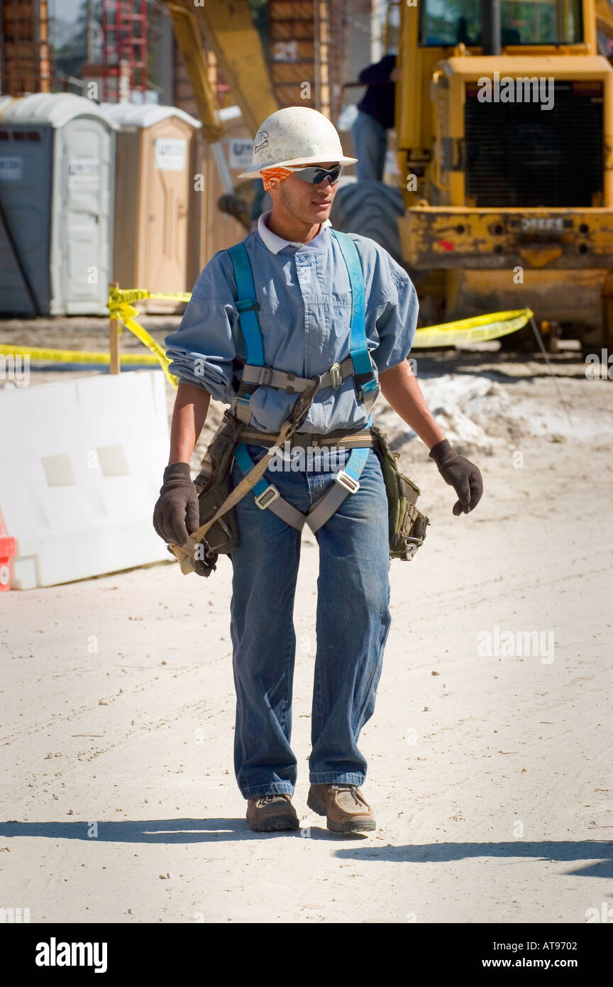 Construction workers with protective clothing and hard hats work on ...