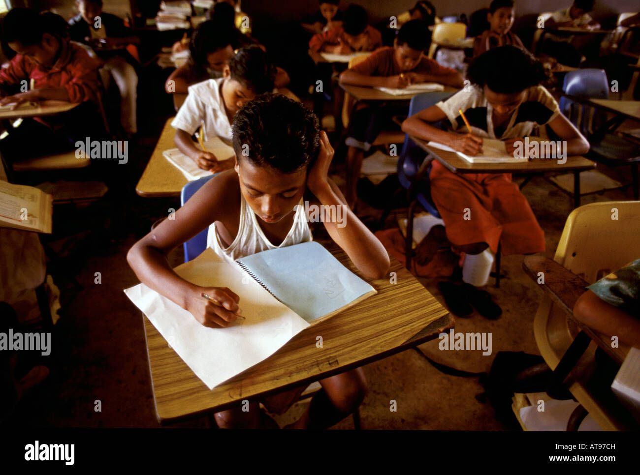Children studying in school, writing in notebook, in Yap Micronesia ...