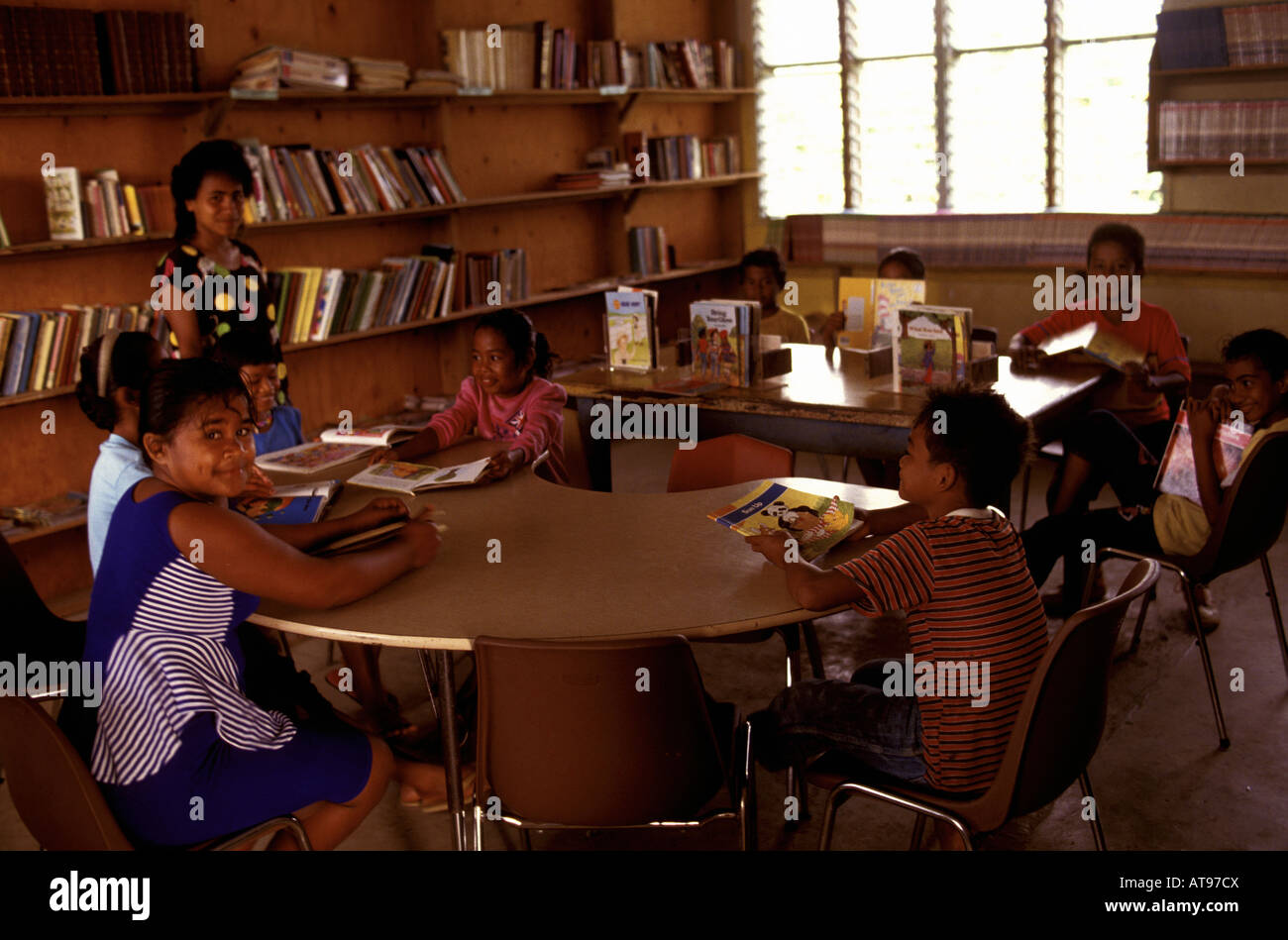 Children studying in school, writing in notebook, in Yap Micronesia ...