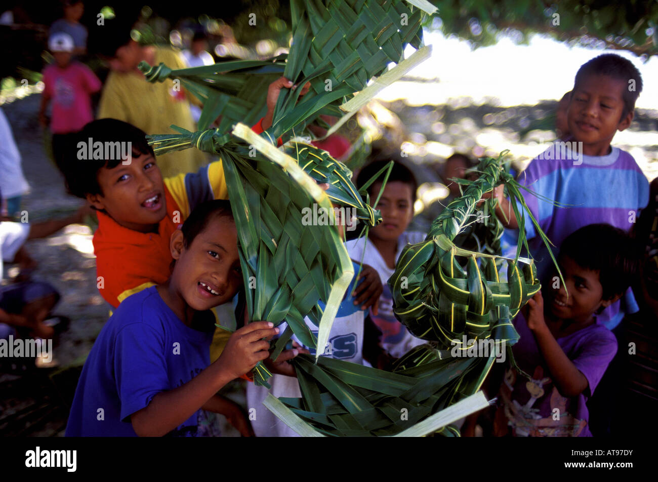 Young native boys in Yap display ti leaf handicrafts, in Yap ...