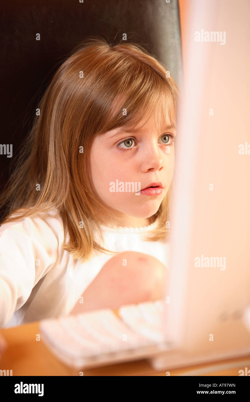 Child working at a computer Stock Photo - Alamy
