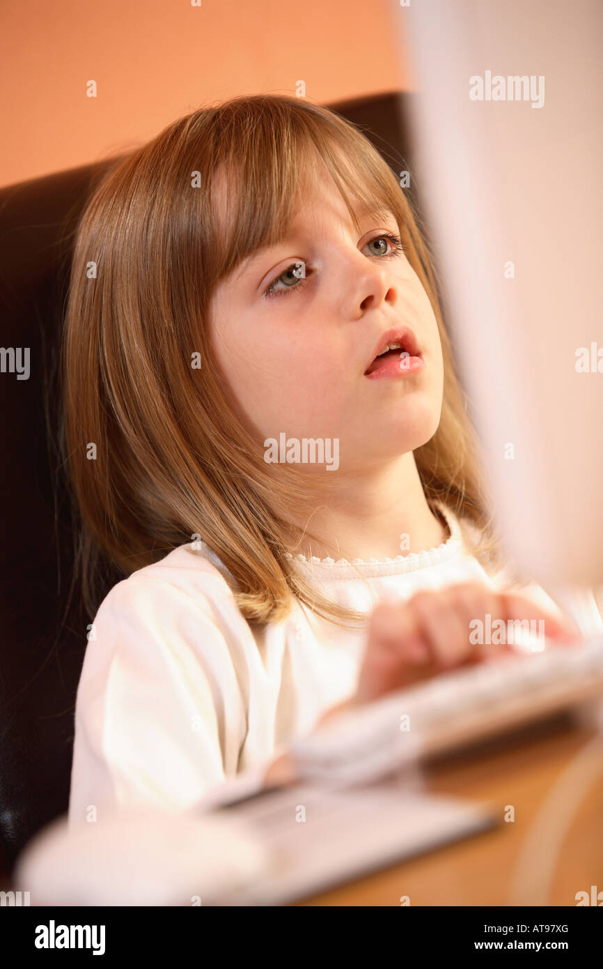 Close-up of a child working at a computer Stock Photo - Alamy