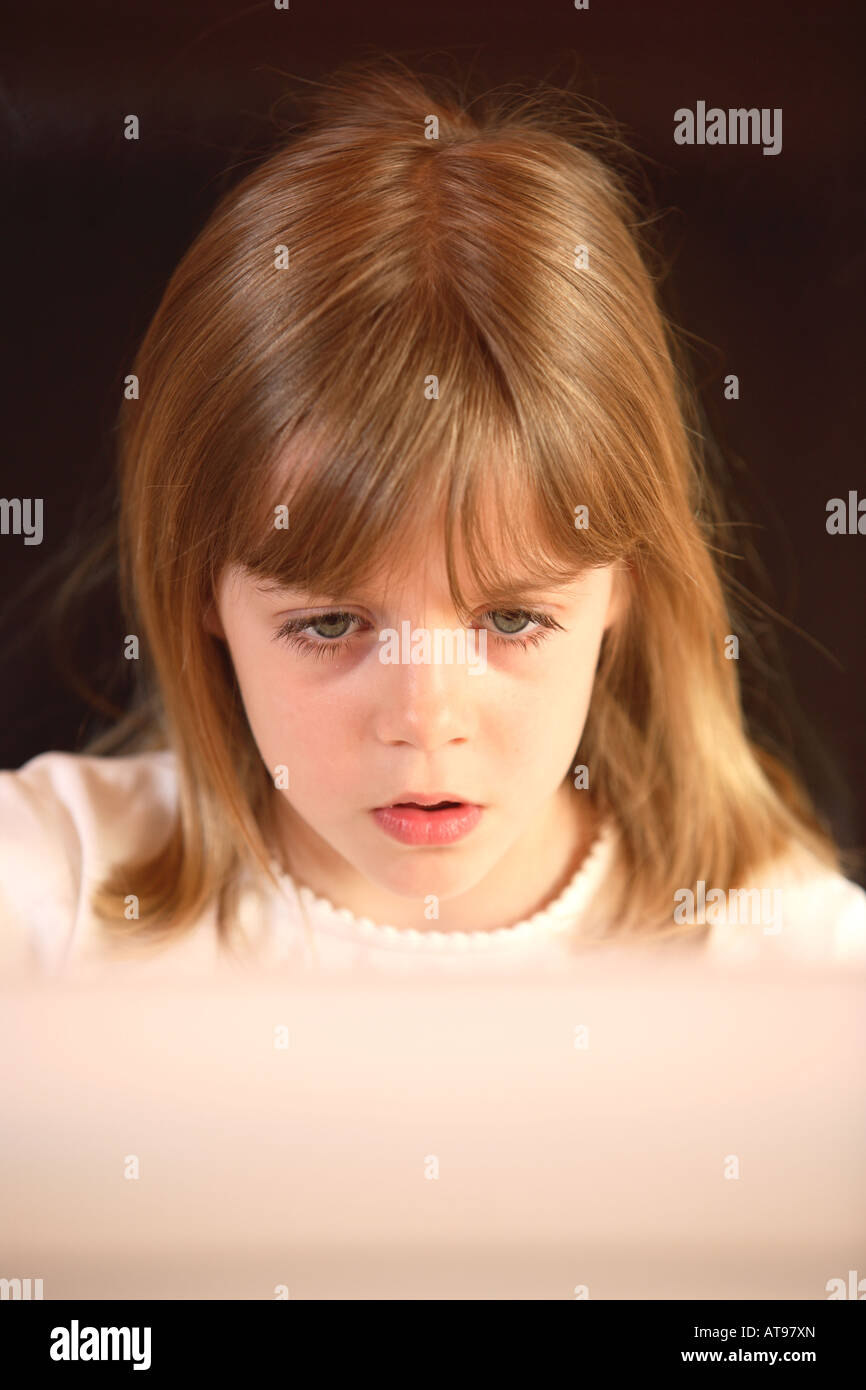 Close-up of a child working at a computer Stock Photo - Alamy