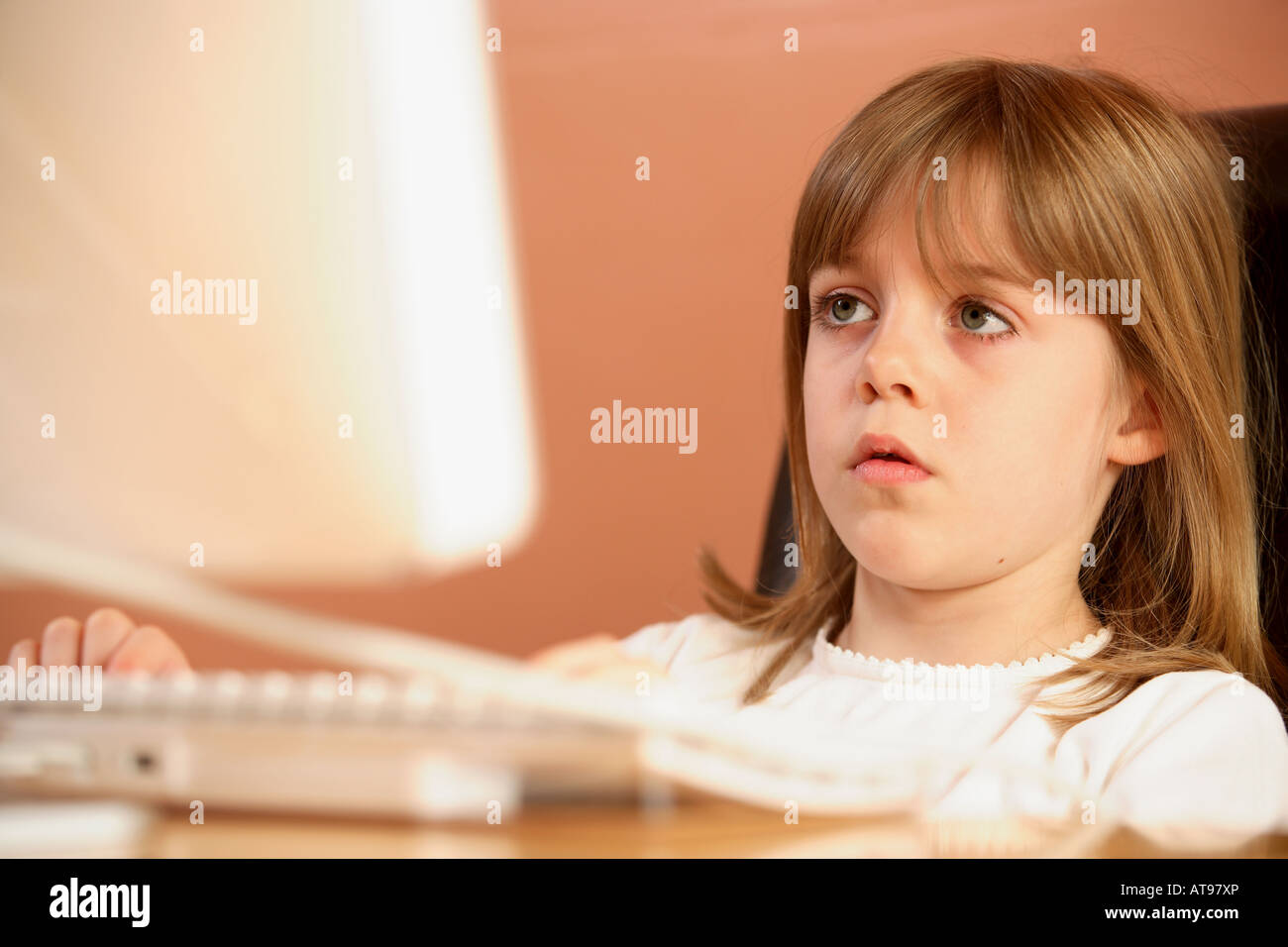 A child working at a computer Stock Photo - Alamy