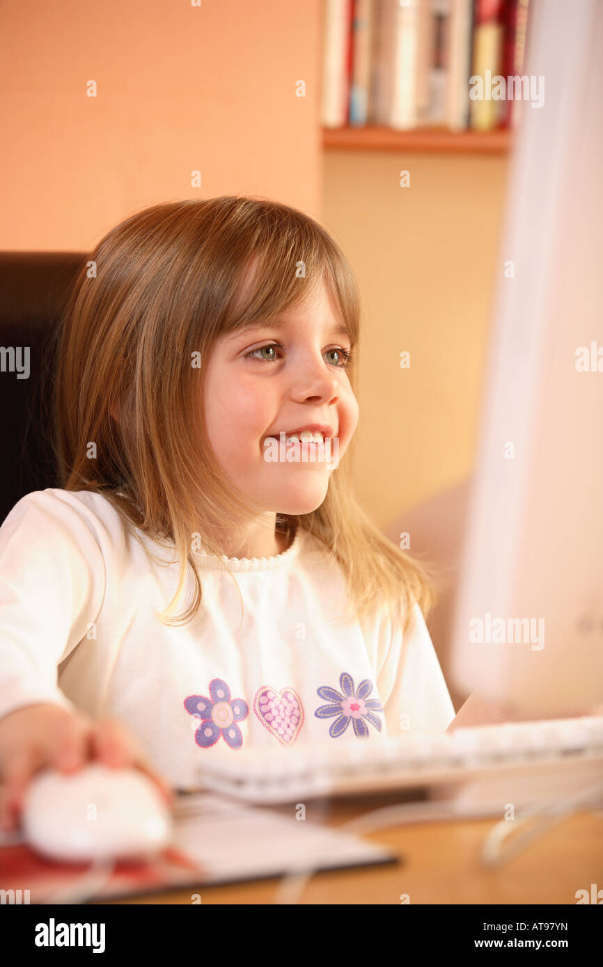 Child working at a computer Stock Photo - Alamy