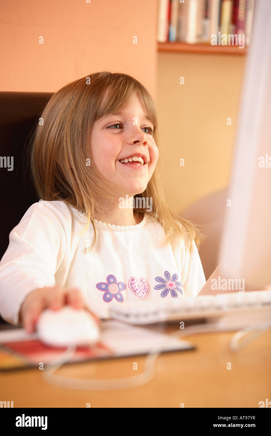 Child working at a computer Stock Photo - Alamy