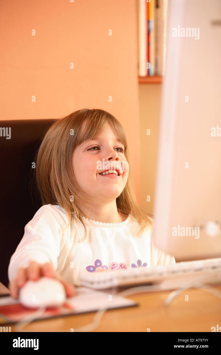 Child working at a computer Stock Photo - Alamy
