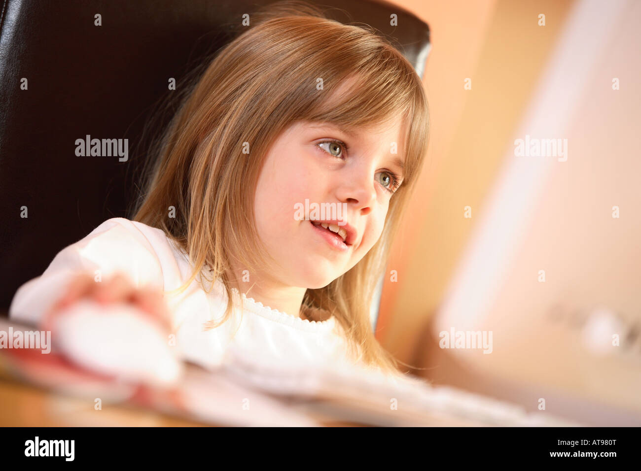 Child working at a computer Stock Photo - Alamy