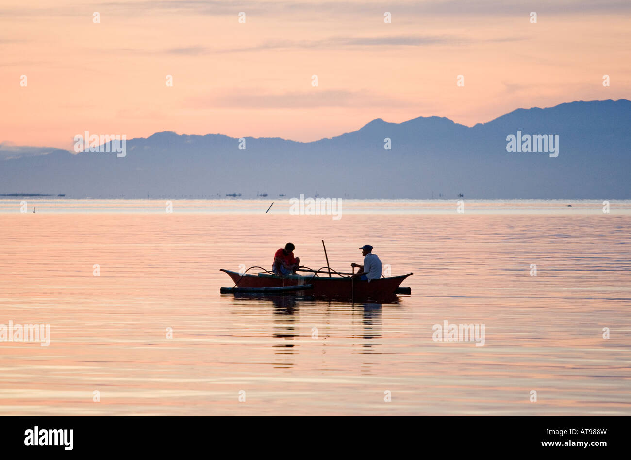 Fishermen fishing early in the morning Stock Photo - Alamy