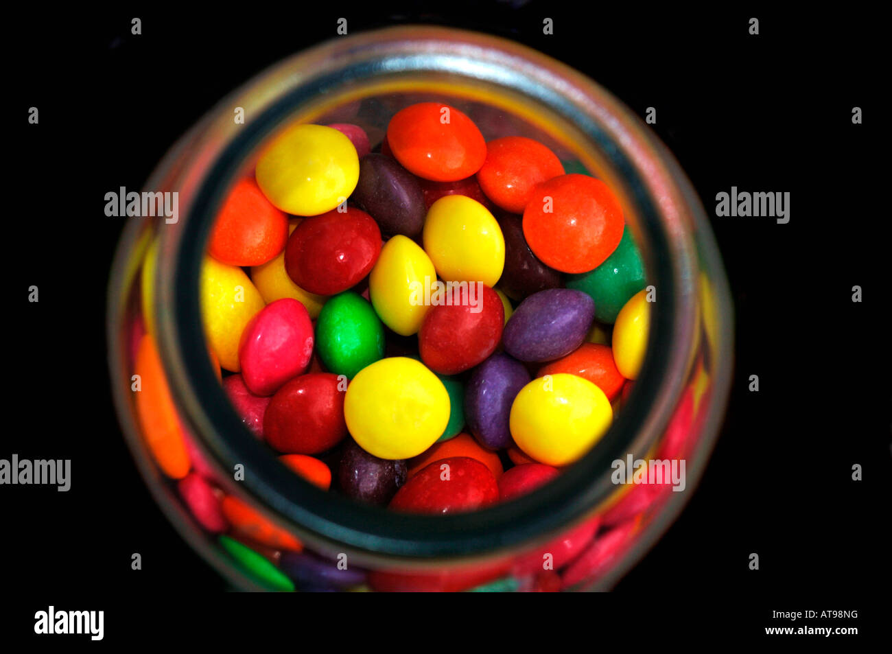 A Glass Jar Filled With Multi Coloured Sweets/Candy Stock Photo - Alamy