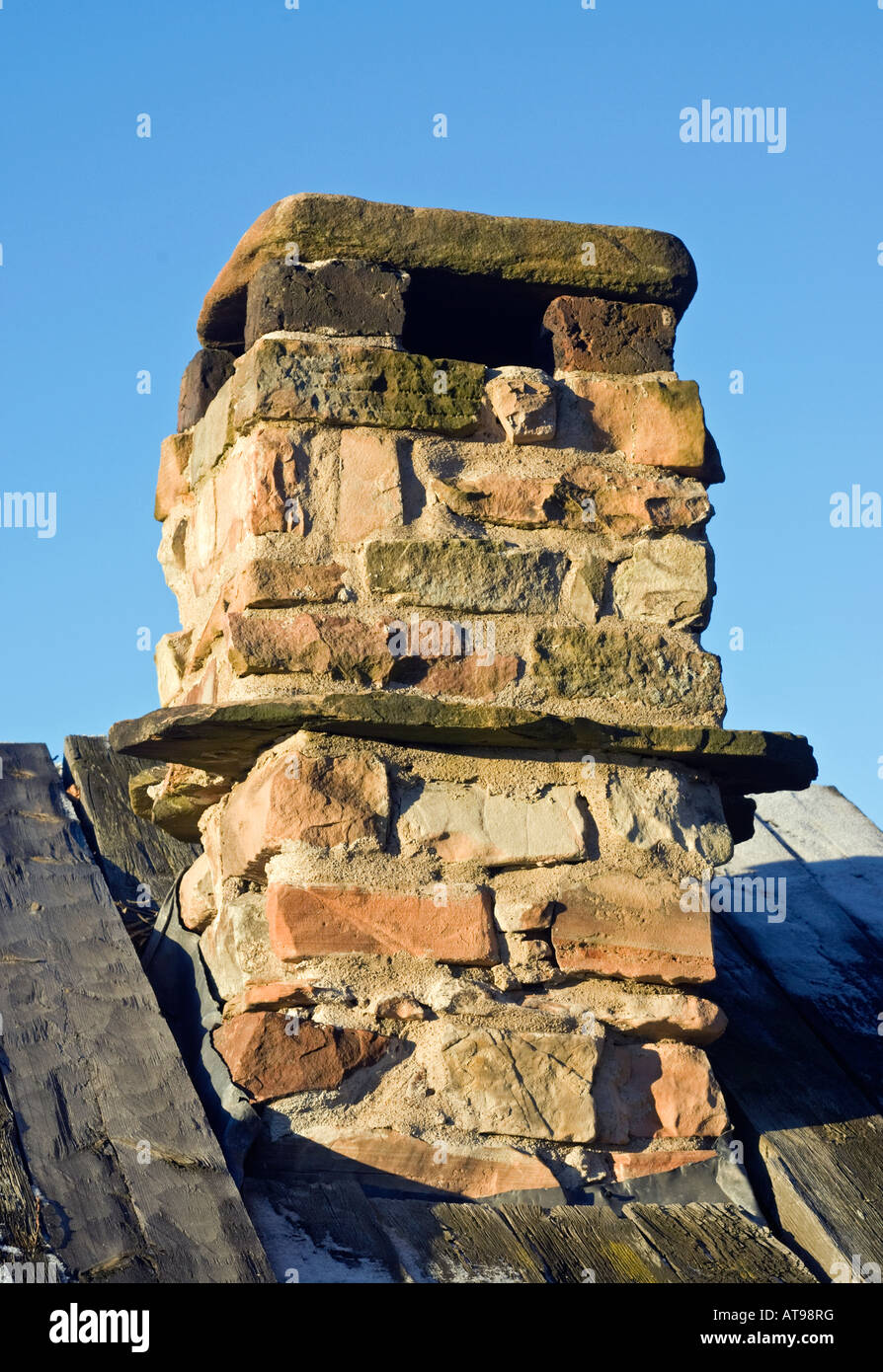Brick smokestack on old cabin Stock Photo - Alamy