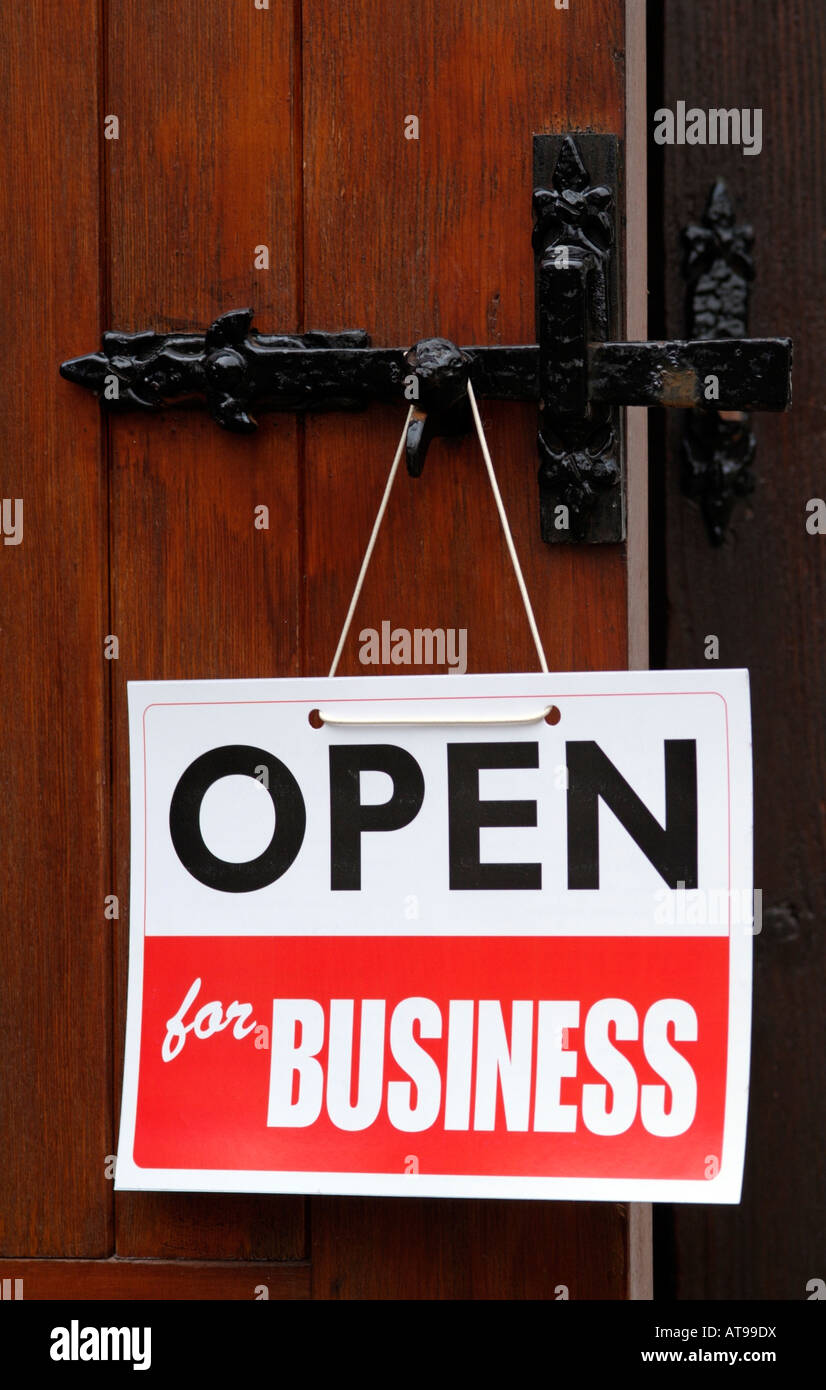 Hanging Sign on door latch Open For Business Stock Photo - Alamy