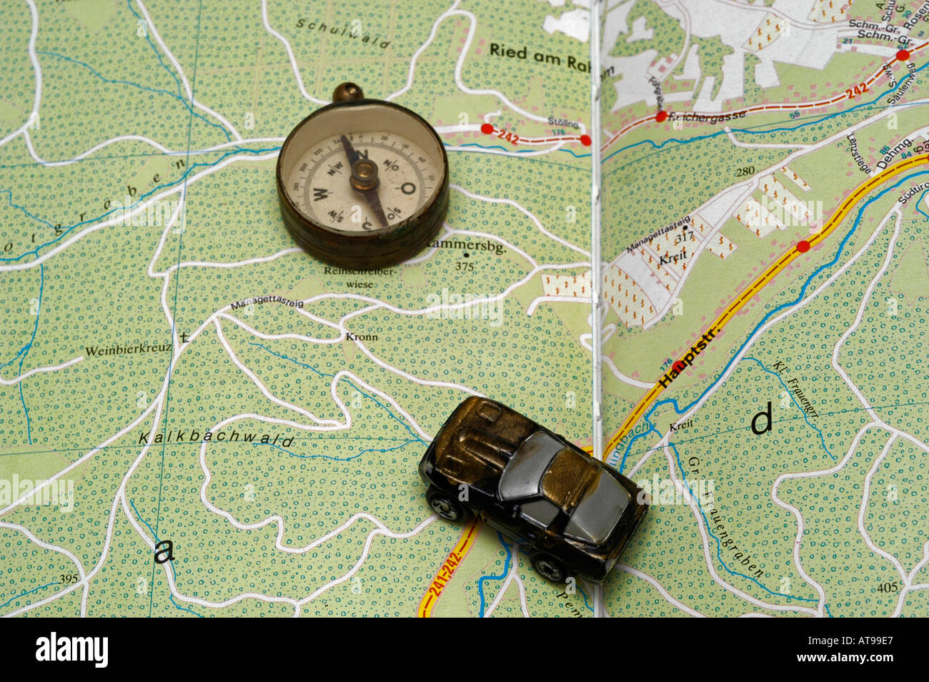 car on a map, compass Stock Photo - Alamy