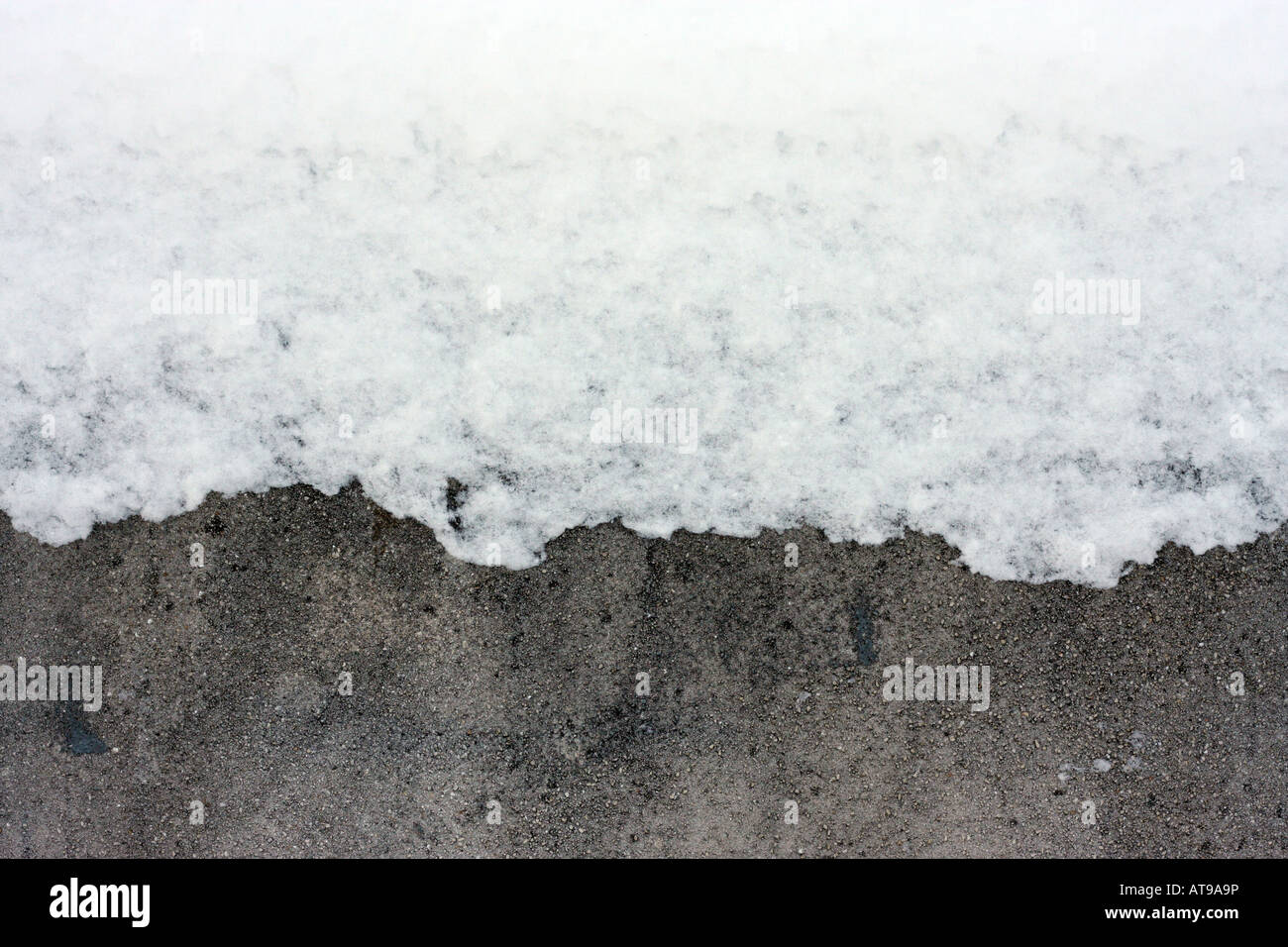 Snow over concrete wall Stock Photo - Alamy