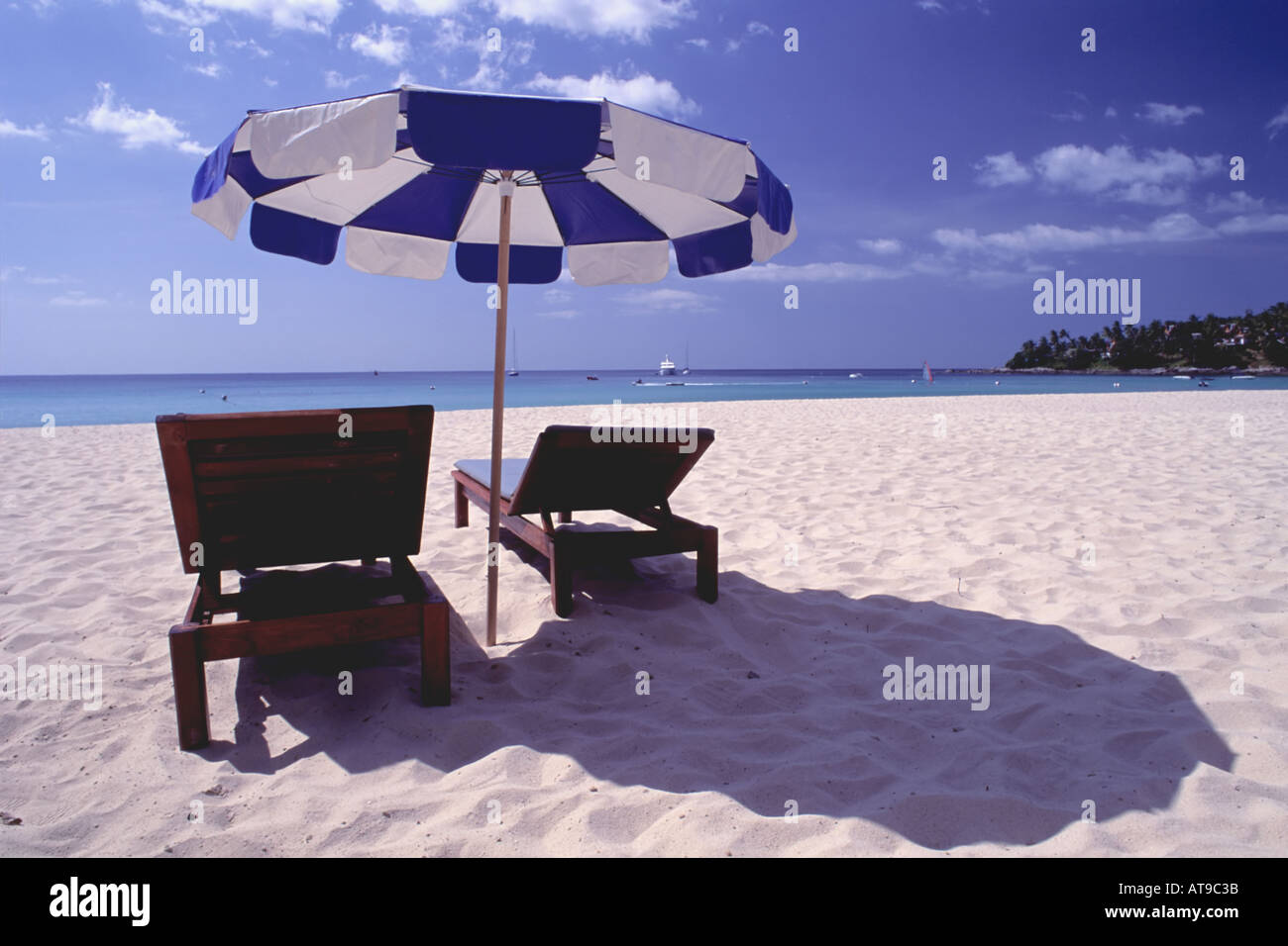 Thailand, Phuket, Phansi Beach, Chairs and sunshade on white beach ...