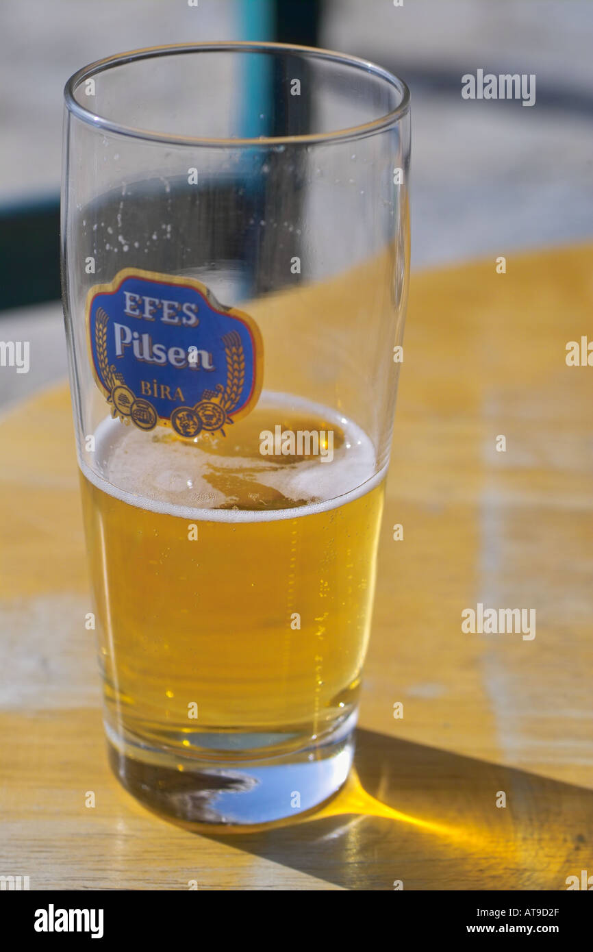 A half full glass of Efes beer Turkish lager Turkish law has a zero ...