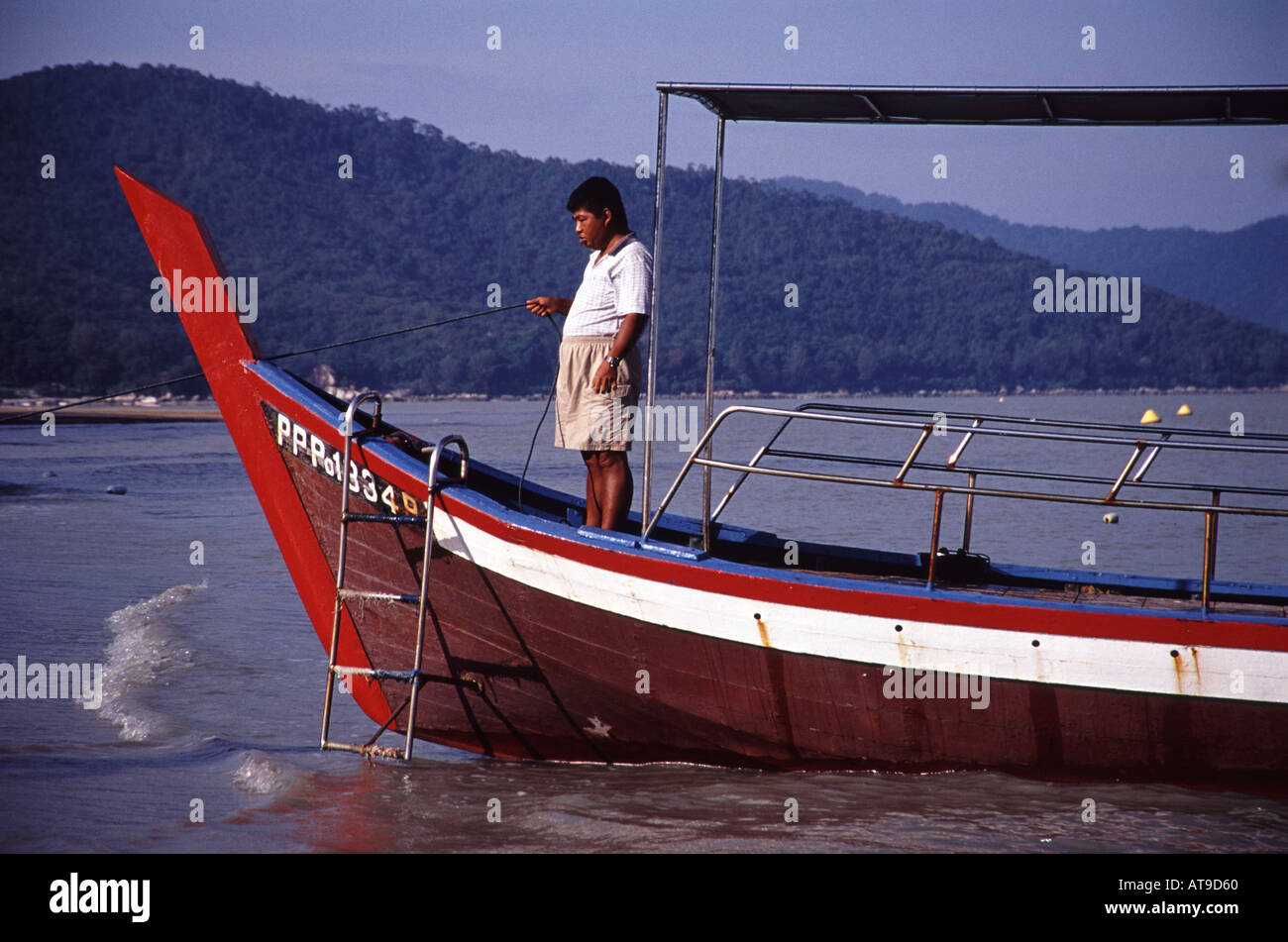 Traditional fishing boat on a beach in Penang in Malaysia Stock Photo ...