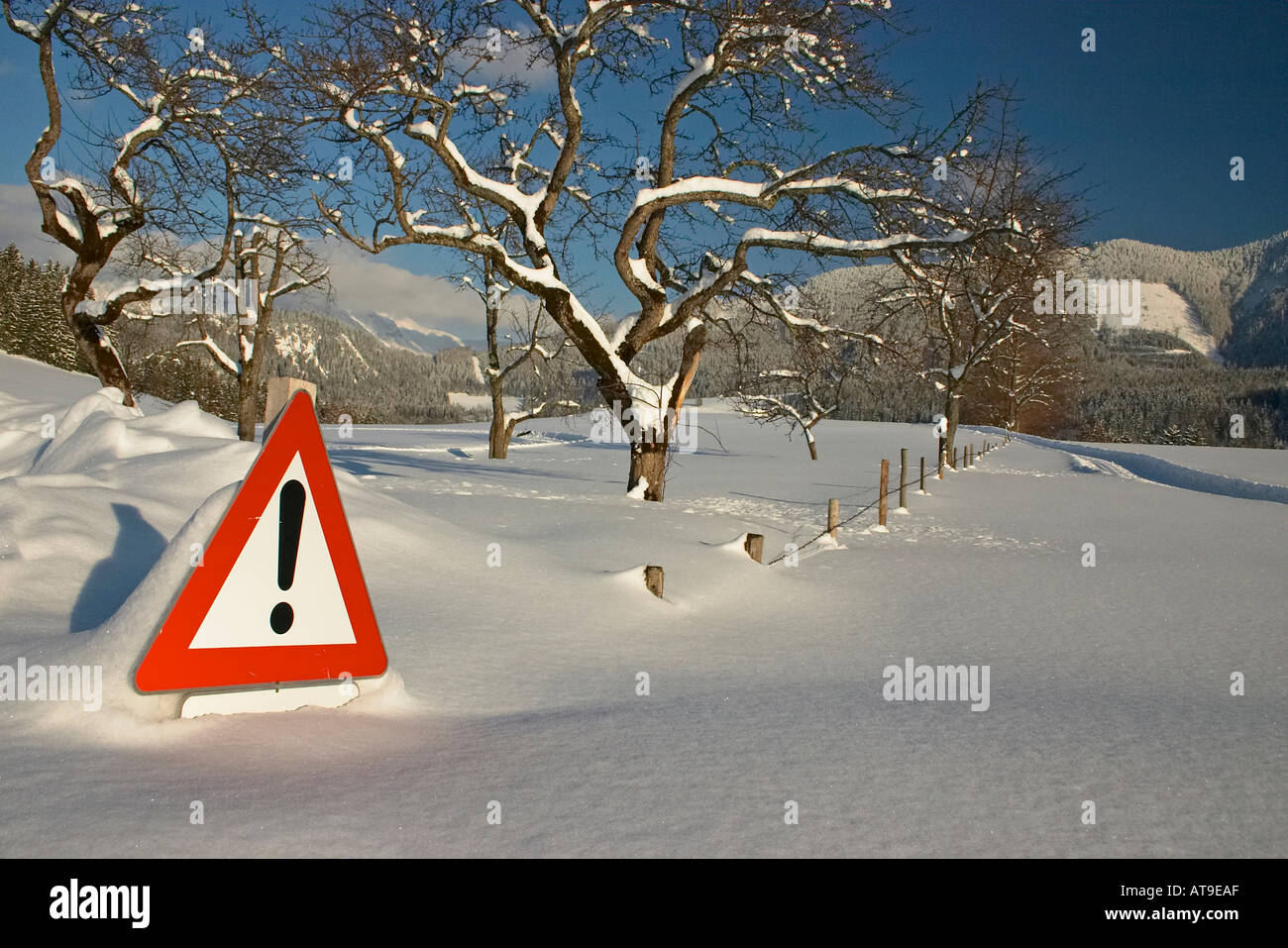 danger sign in snowy landscape Stock Photo - Alamy