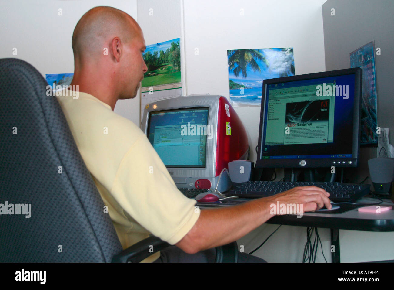 Working with two computers hi-res stock photography and images - Alamy