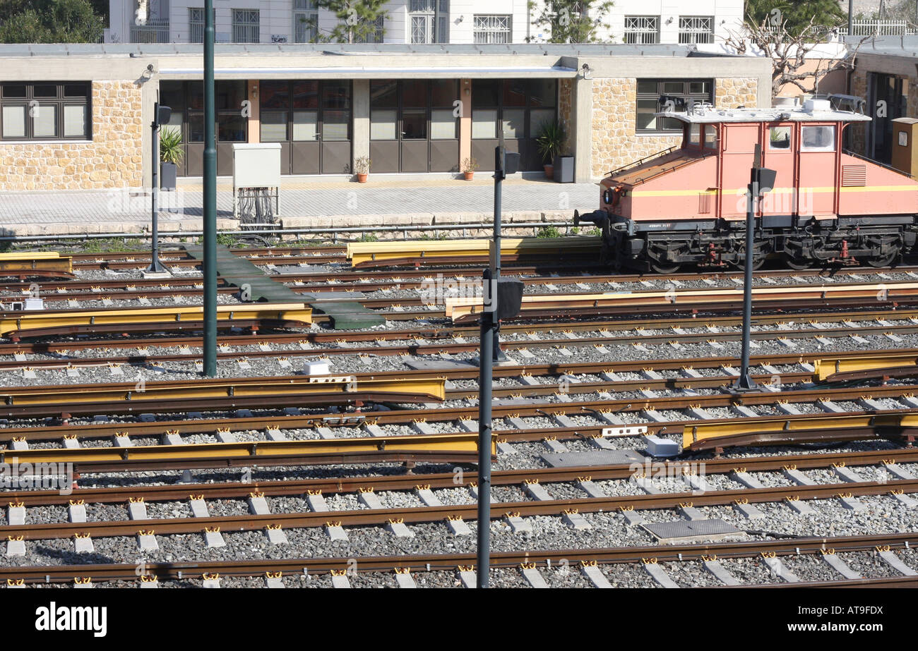 Railway tracks and depot with train Stock Photo - Alamy