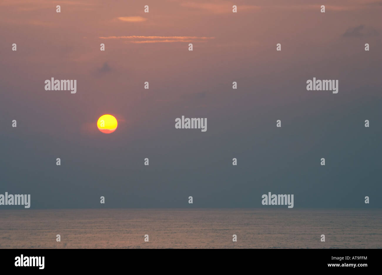 Clouds in the marine layer creep across the sunset Stock Photo - Alamy