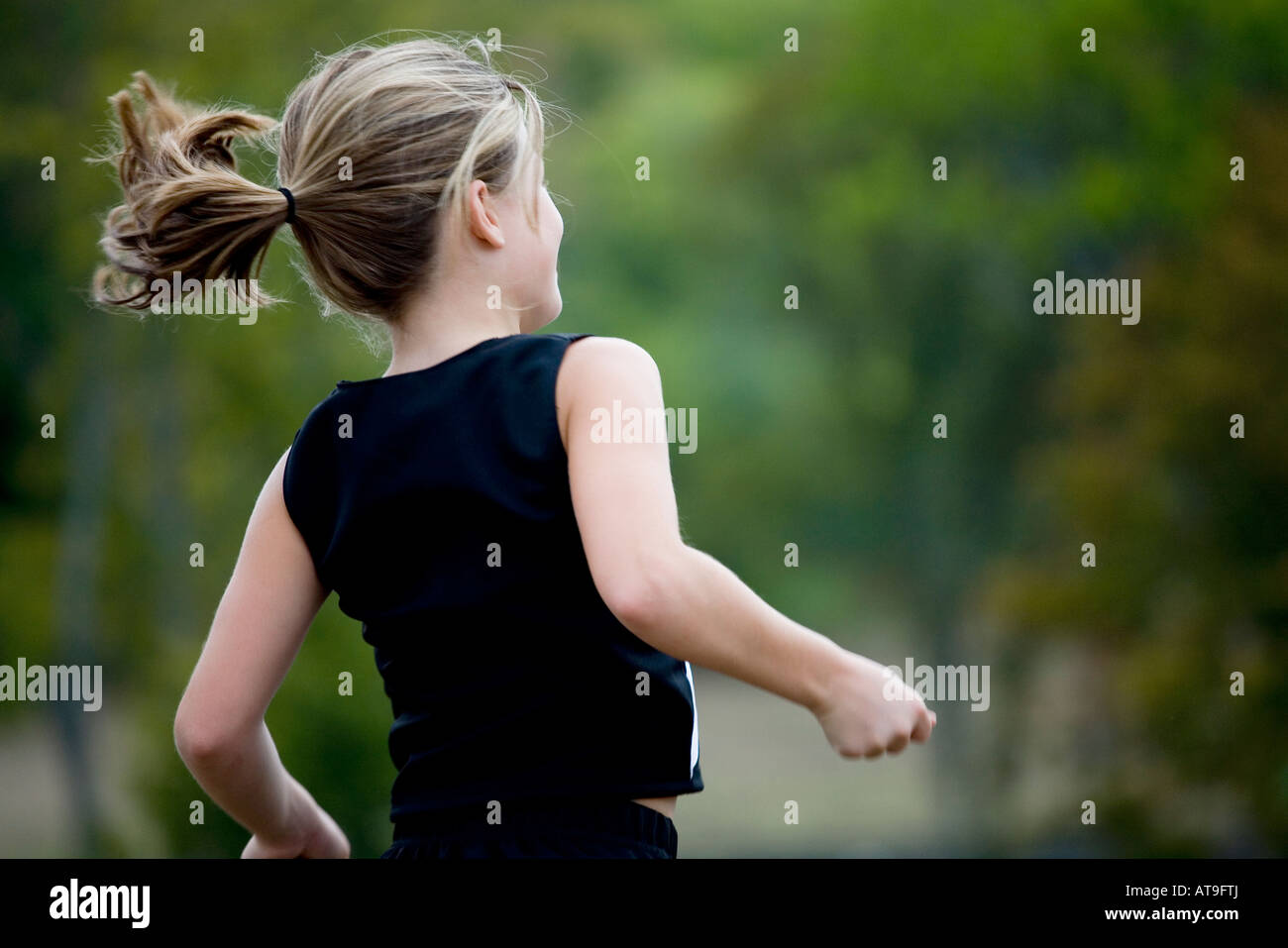 Young girl running Stock Photo - Alamy