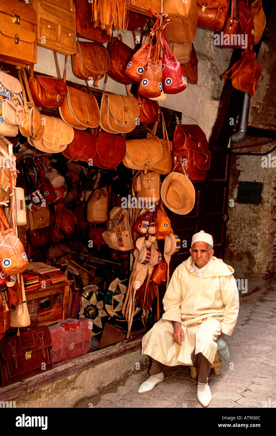1, one, Moroccan man, vendor, selling leather goods, shop, medina, Fes ...