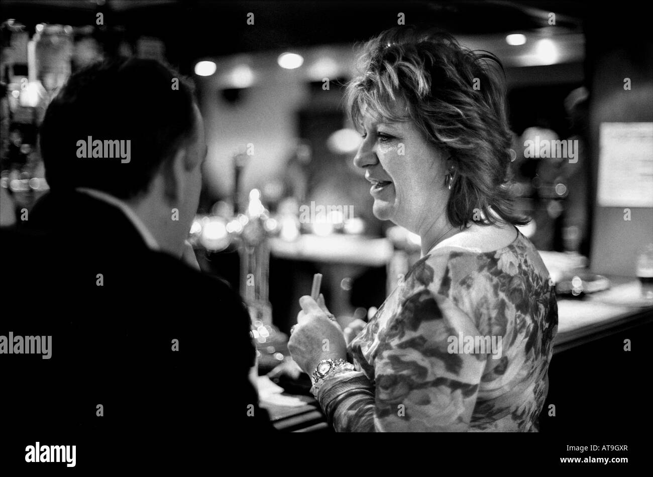 Conversation at bar Black and White Stock Photos & Images - Alamy