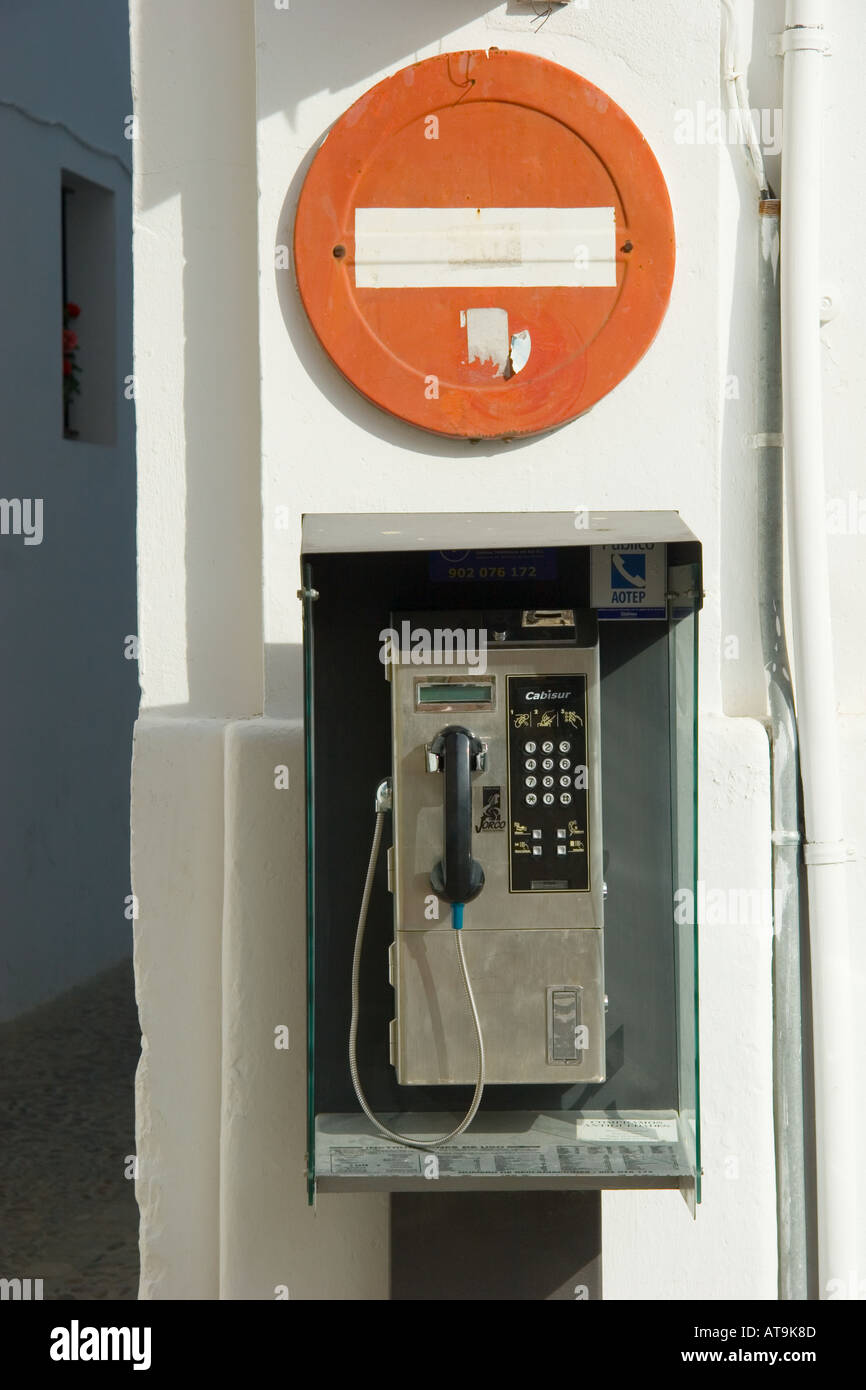 Public telephone box below No Entry sign in Arcos de la Frontera Cadiz ...