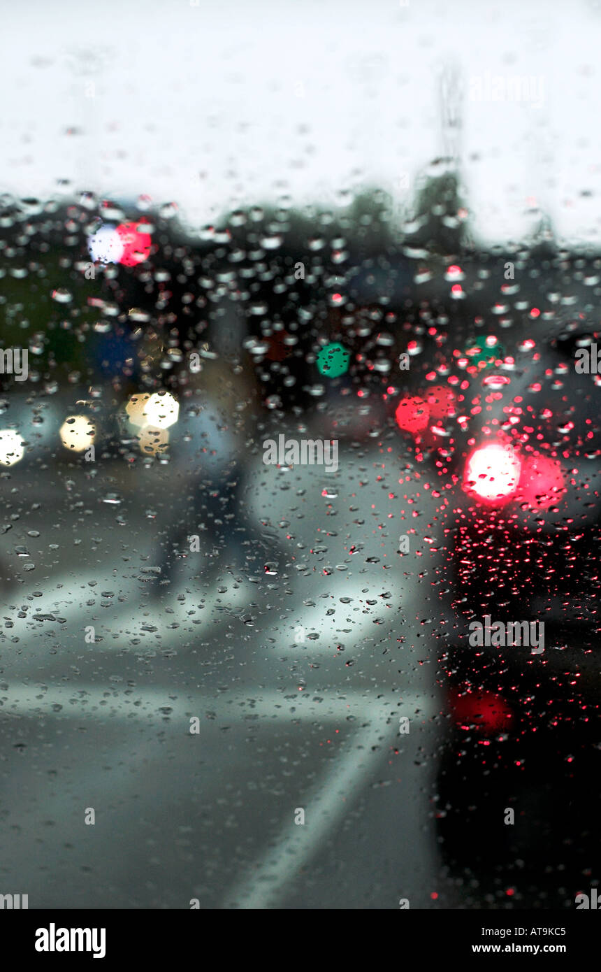 Traffic situation through rainy car window Stock Photo - Alamy