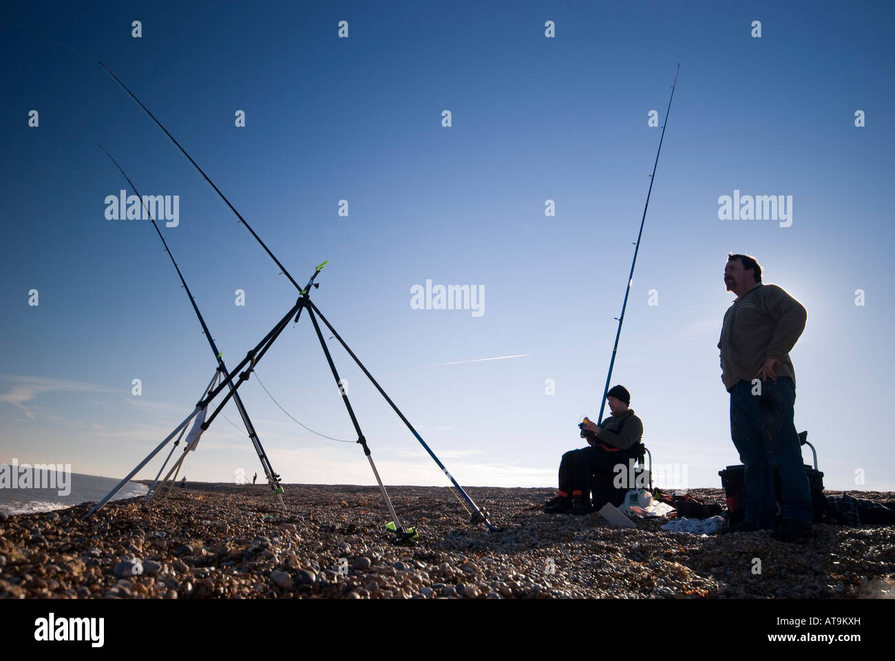 Silhouette two men sea fishing hi-res stock photography and images - Alamy