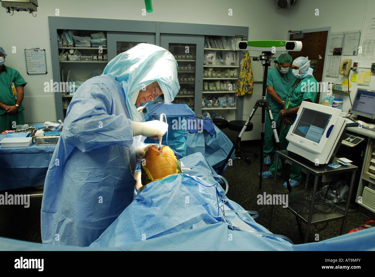 Surgeons perform operation patient in hi-res stock photography and ...