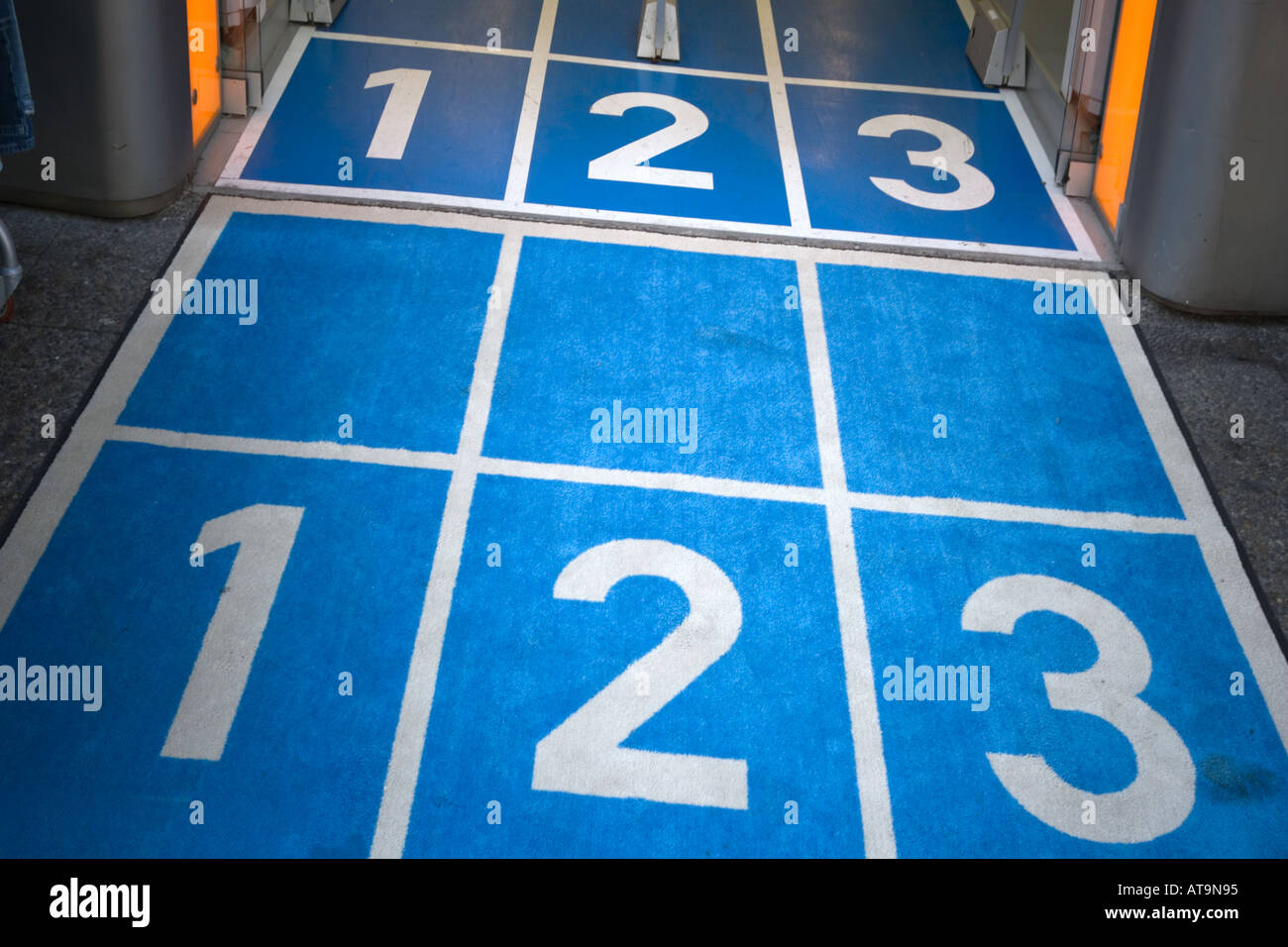 Carpet leading into store decorated with numbers one two three Stock ...
