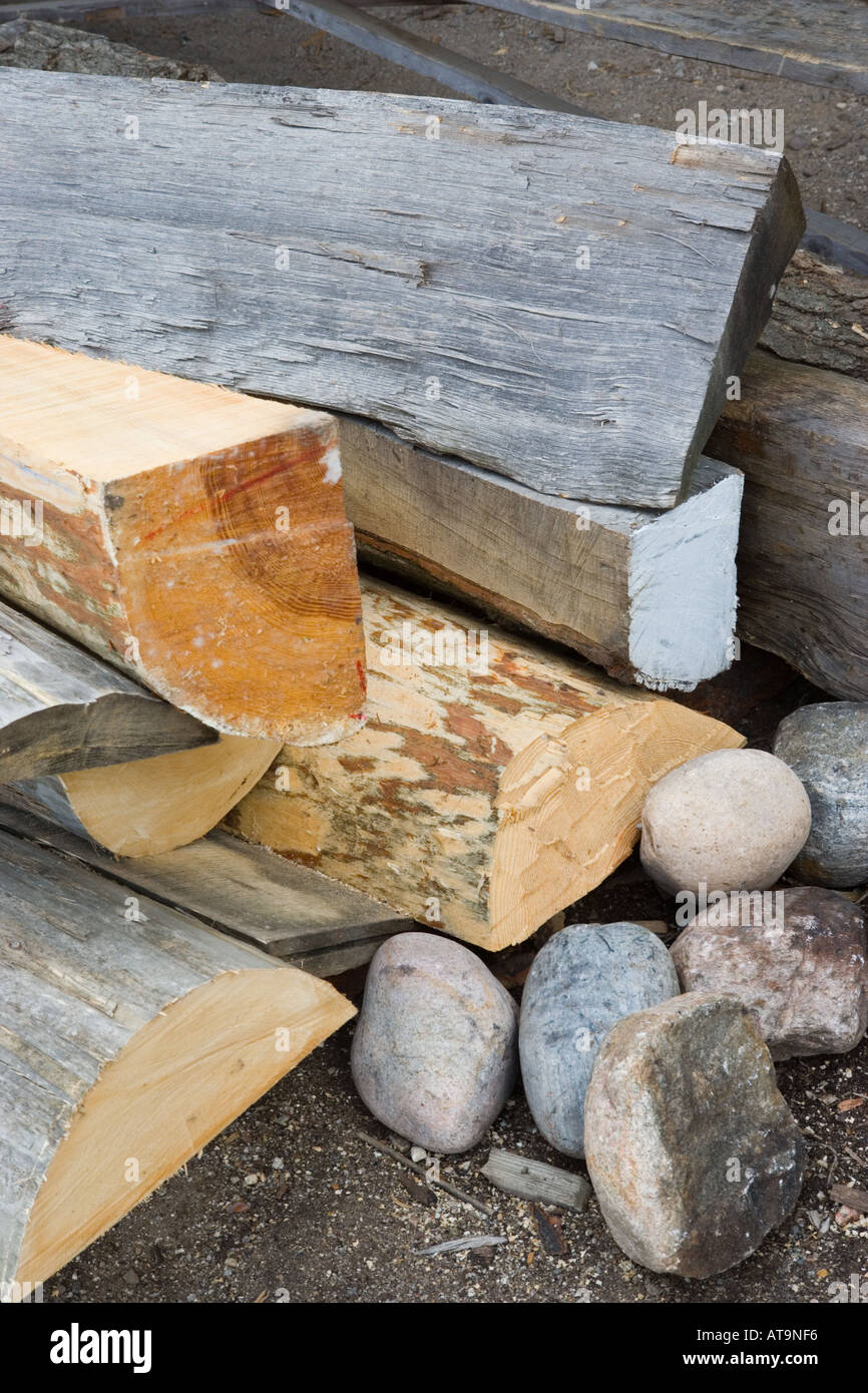 Logs and rocks Stock Photo - Alamy