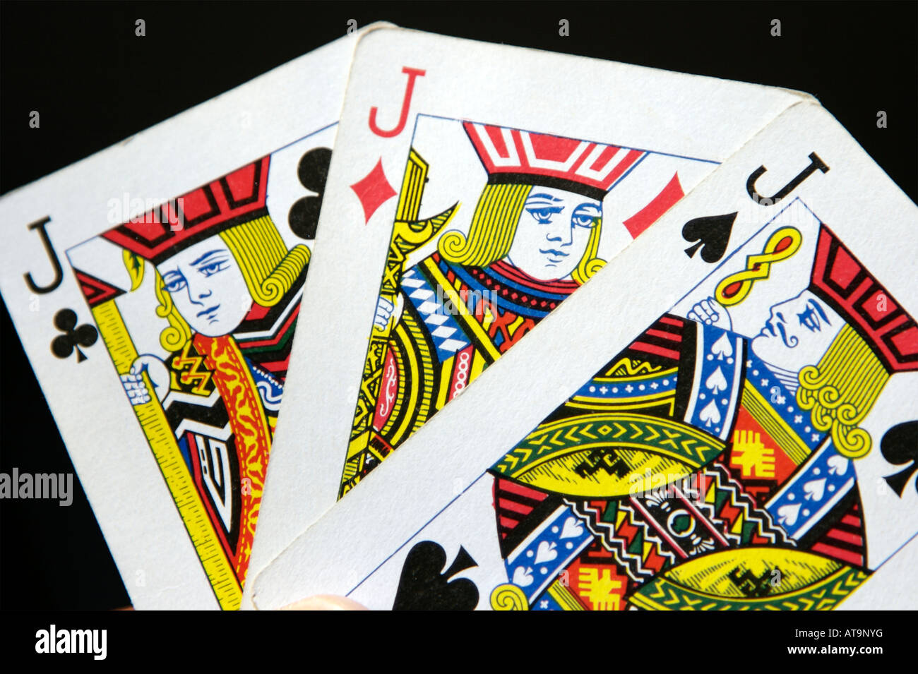 Three jacks in a hand of cards Stock Photo - Alamy