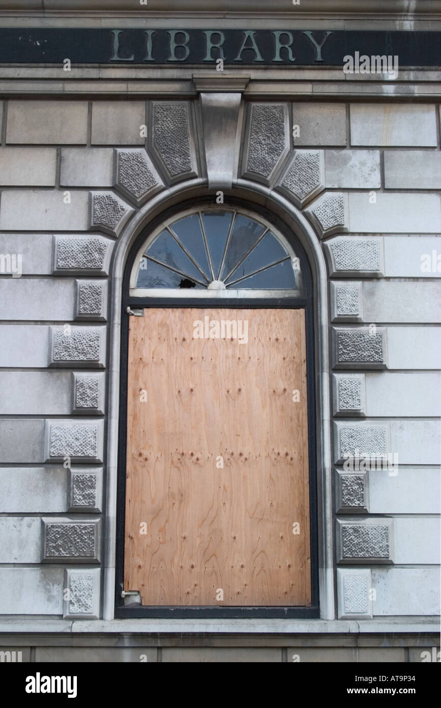 Boarded up window from closed public library. Limehouse, London ...
