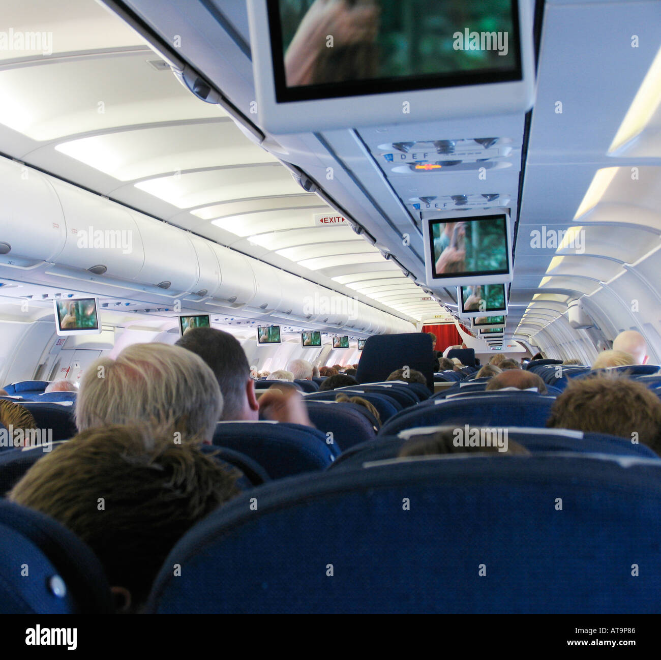Interior of jet airliner during flight Stock Photo - Alamy