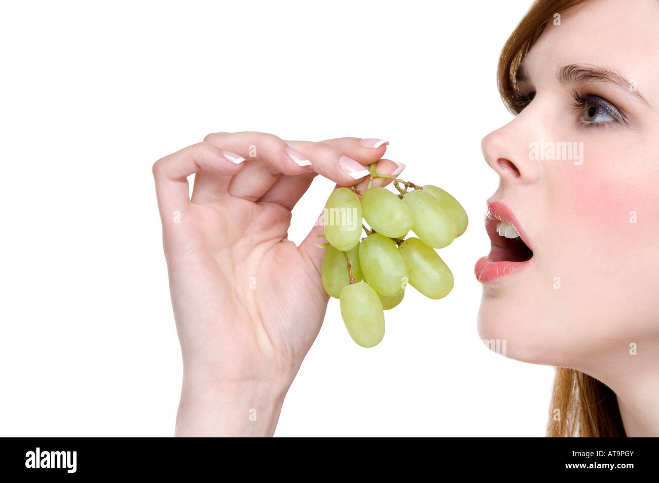 woman eating grapes Stock Photo - Alamy