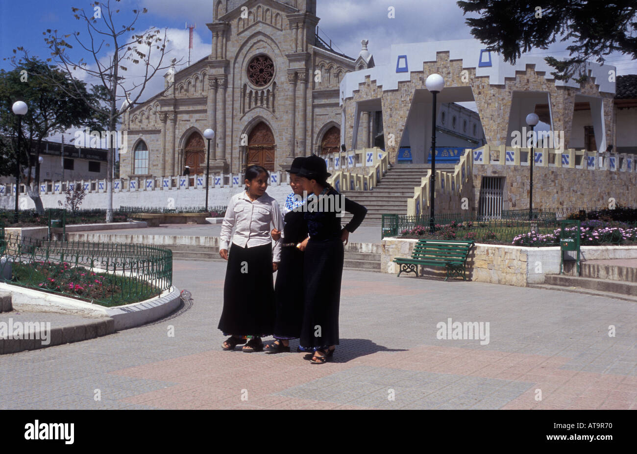 Indigenous girls in typical clothes walking in front of the church in ...