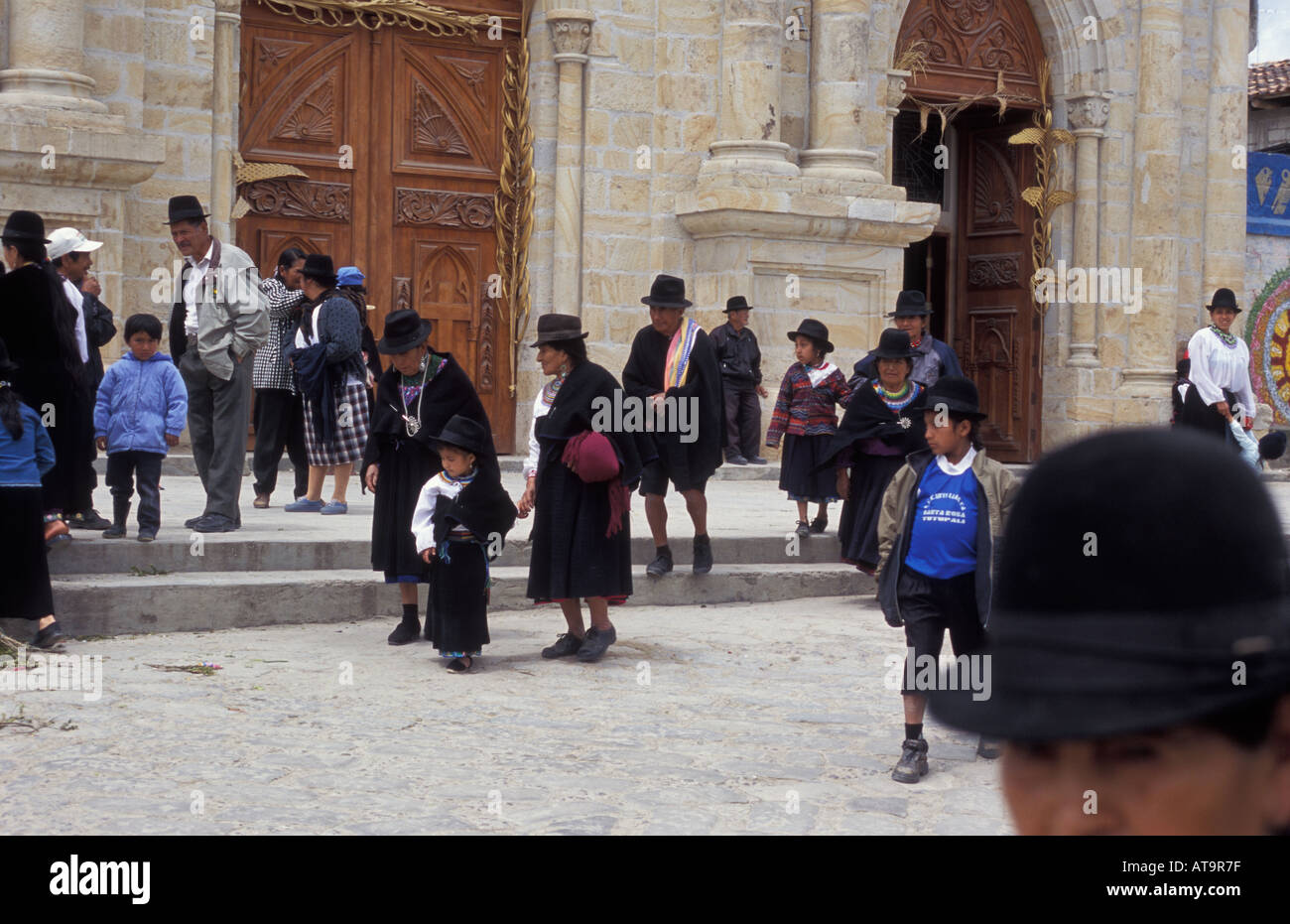 Indigenous people of Saraguro leaving the church after Sunday mass in ...