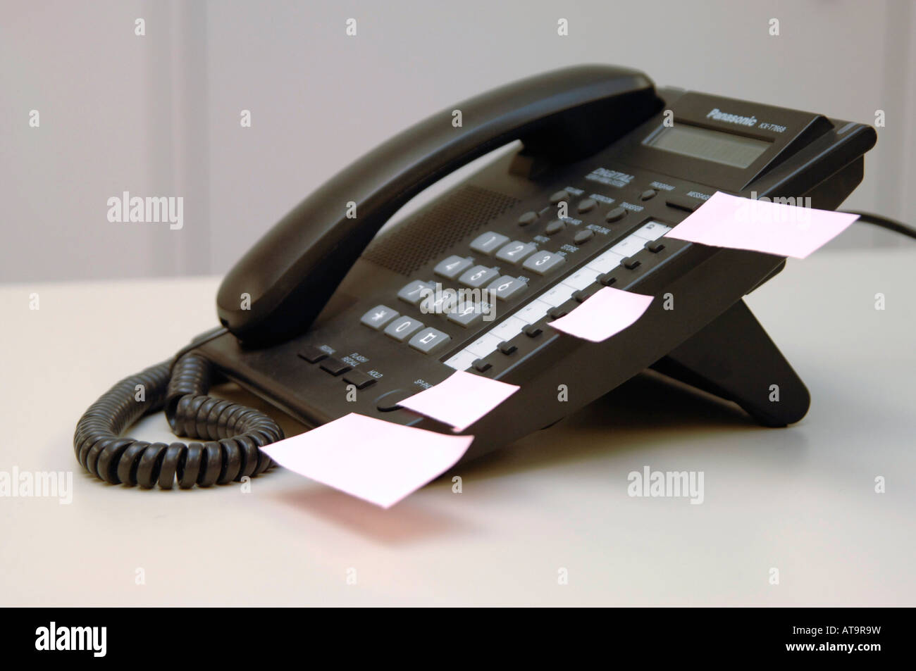 Telephone with "post it" note Stock Photo - Alamy