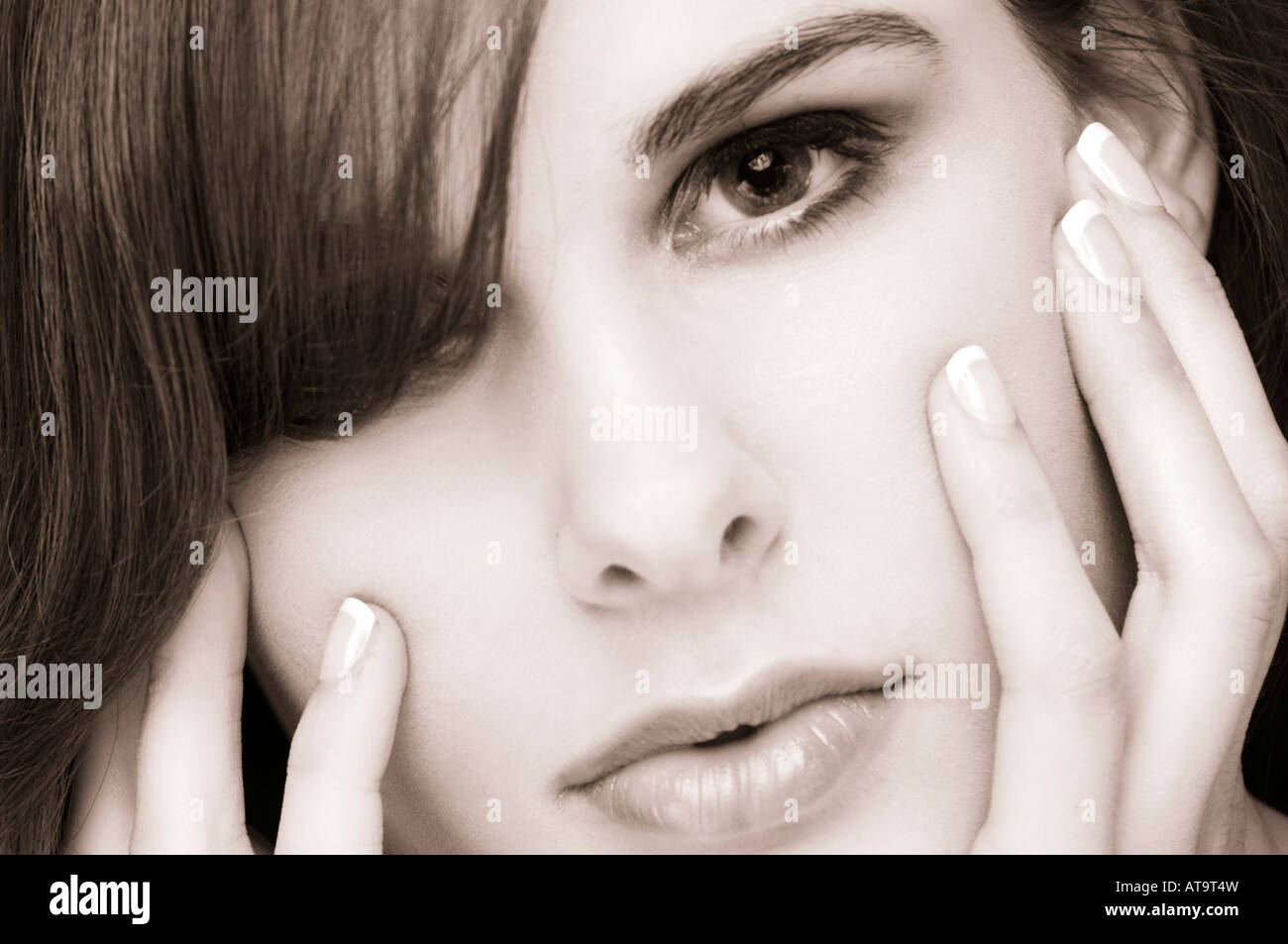 woman with her head in her hands eye contact Stock Photo - Alamy