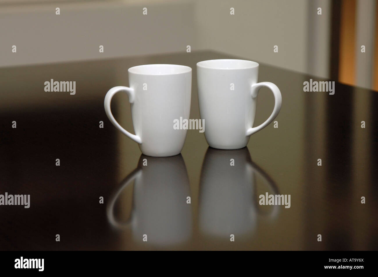 Coffee mugs on a meeting room table Stock Photo - Alamy