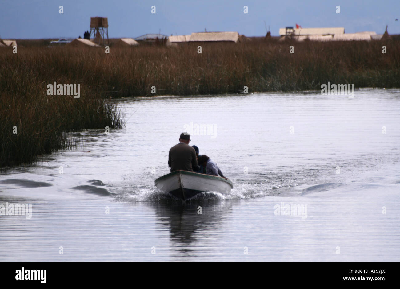 Small motor launch near Uros floating reed village Lake Titicaca Peru ...
