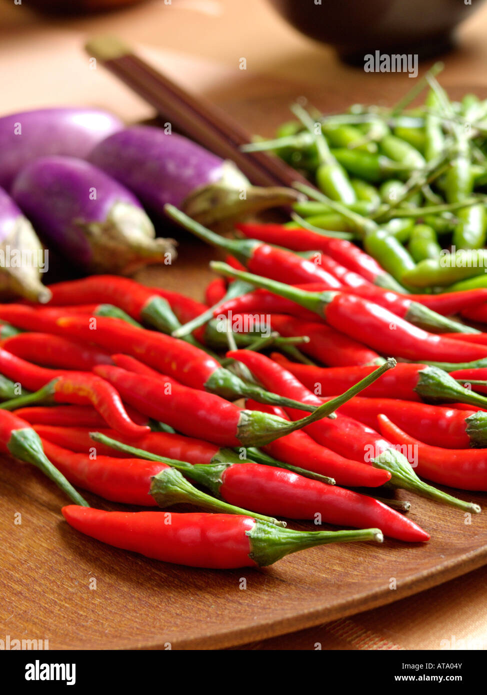 Chili pepper (Capsicum) and aubergine (Solanum melongena Stock Photo ...