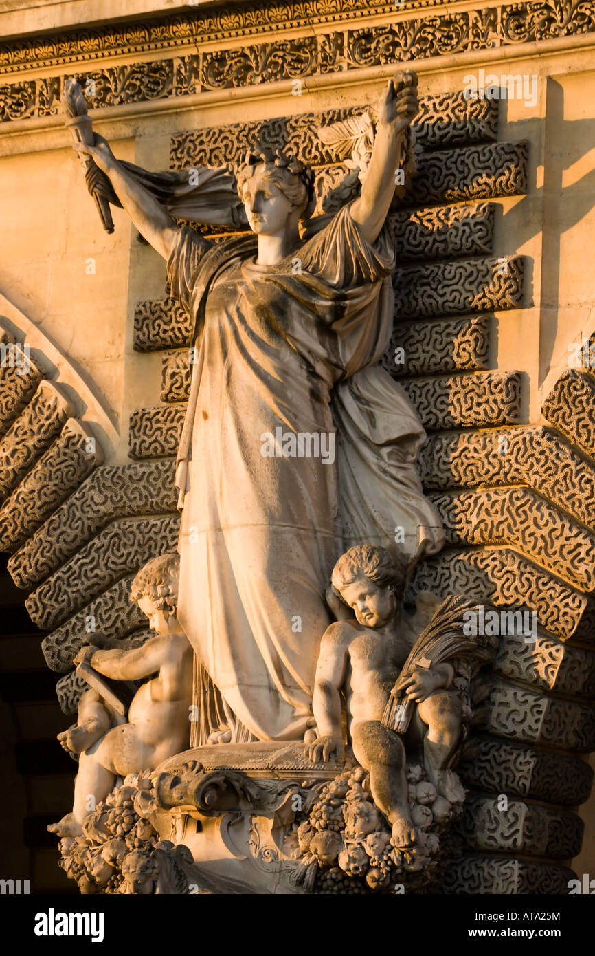 Statue outside the Musee du Louvre, Paris, France, in warm evening ...